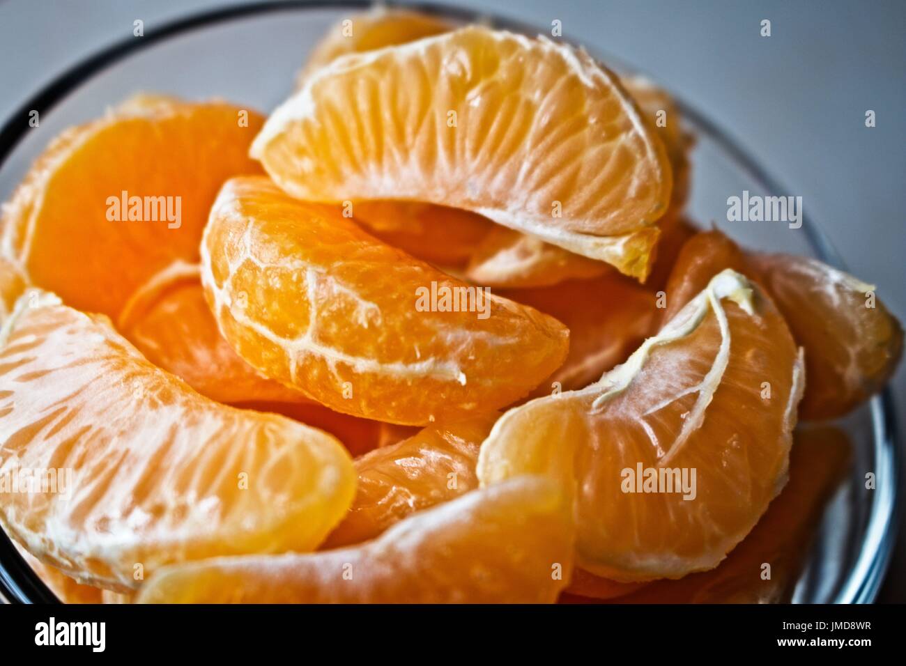 Close up of a bowl of peeled orange segments Stock Photo - Alamy