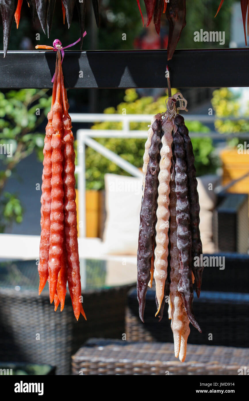 Traditional sausage-shaped candies with walnut in it Stock Photo - Alamy