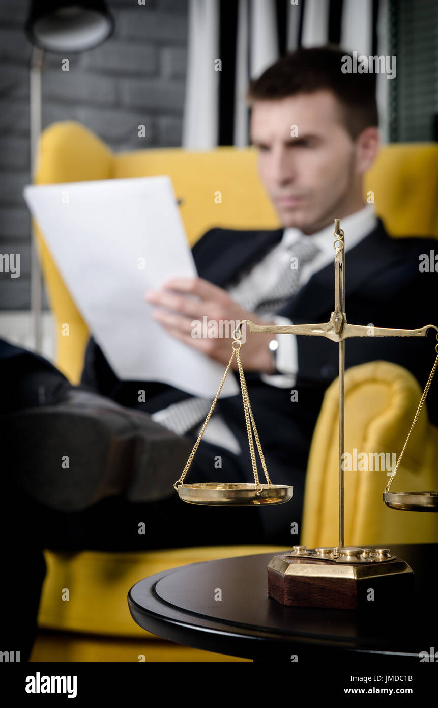 Weight scale of justice, lawyer in background. lawyer document ...