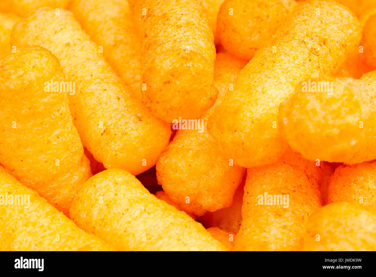 Cheese puff. Cheese puffs snack background texture food pattern Stock ...