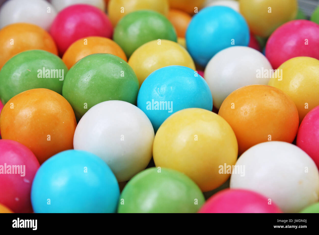 Bubble gum chewing gum texture. Rainbow multicolored gumballs chewing ...