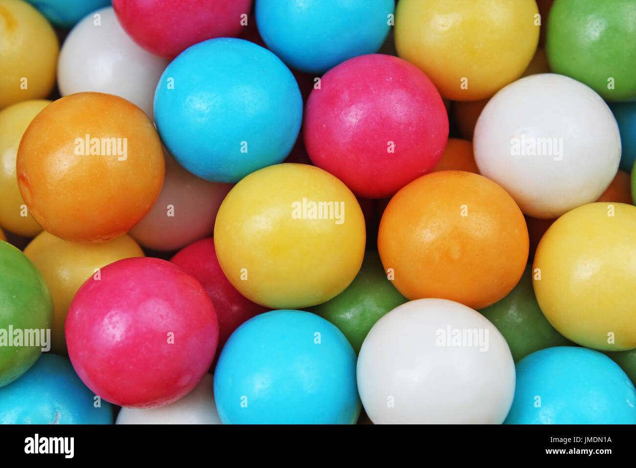 Bubble gum chewing gum texture. Rainbow multicolored gumballs chewing ...