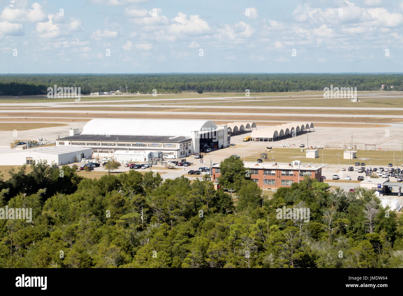 An overhead overlook of military air base and hangars in Pensacola ...