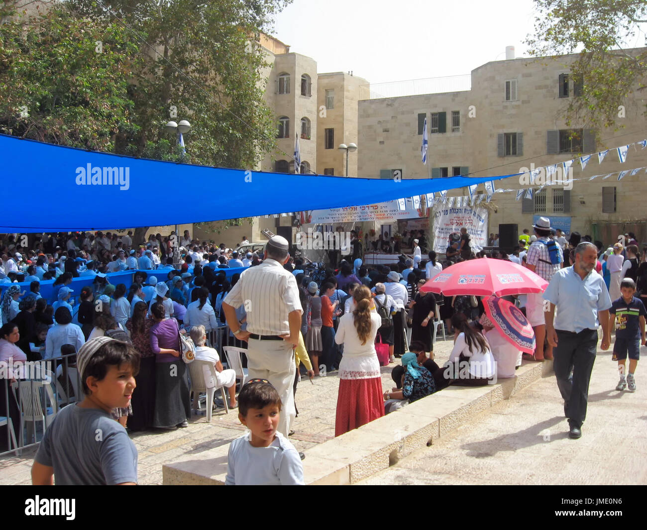 A crowd of Jewish people celebrate Sukkot in the Jerusalem Old City ...