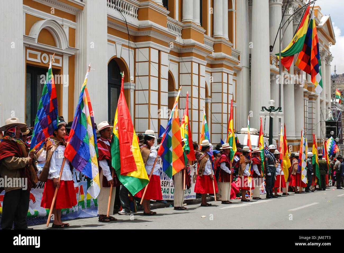 Bolivian people standing with whipala flags during the celebration of ...