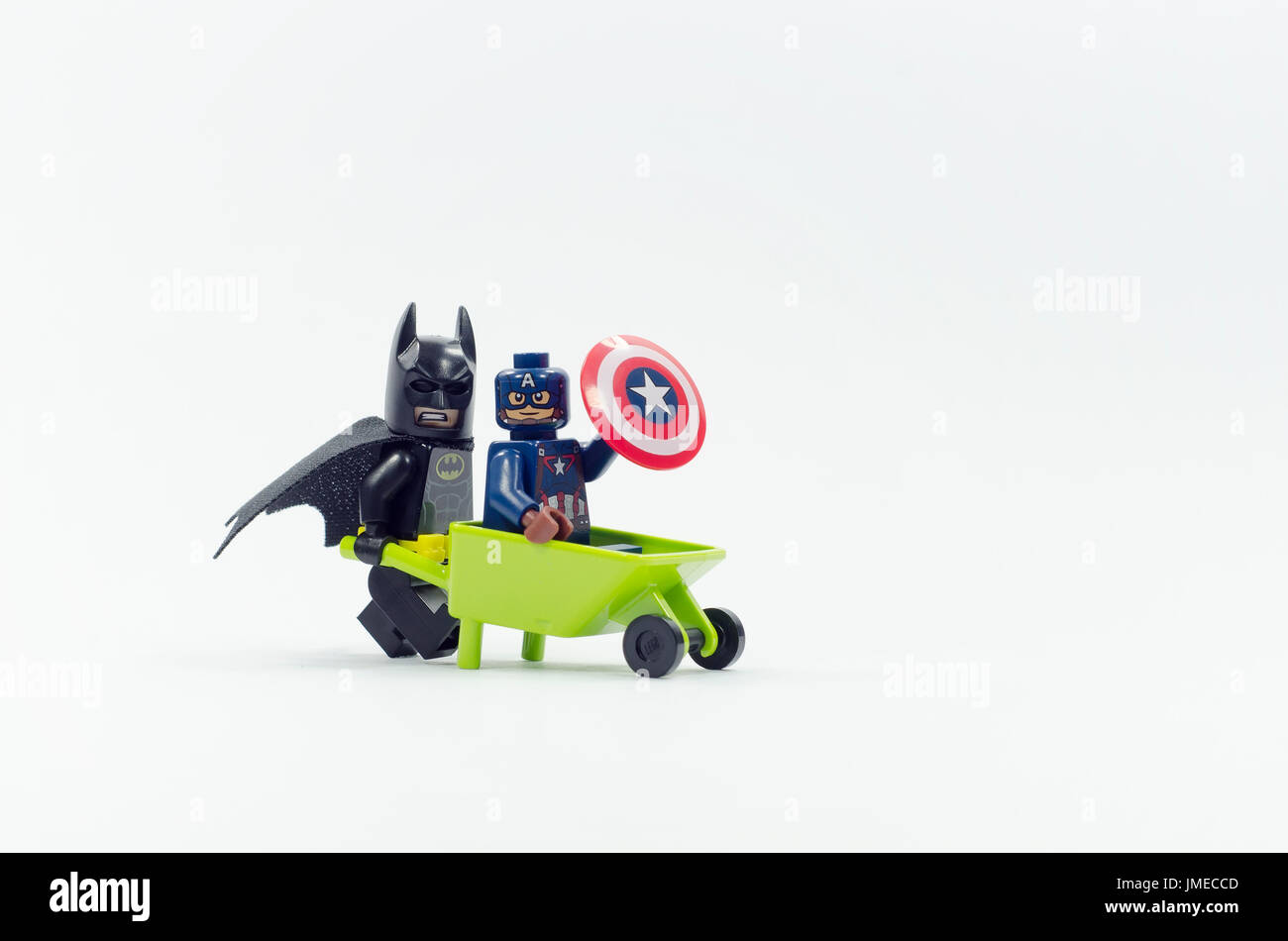 lego captain america minifigure sitting on wheelbarrow while batman ...