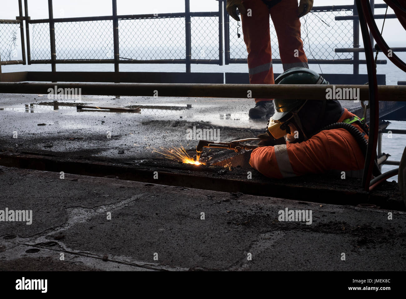 Image of industrial workers, using oxy acetylene cutting torches on ...
