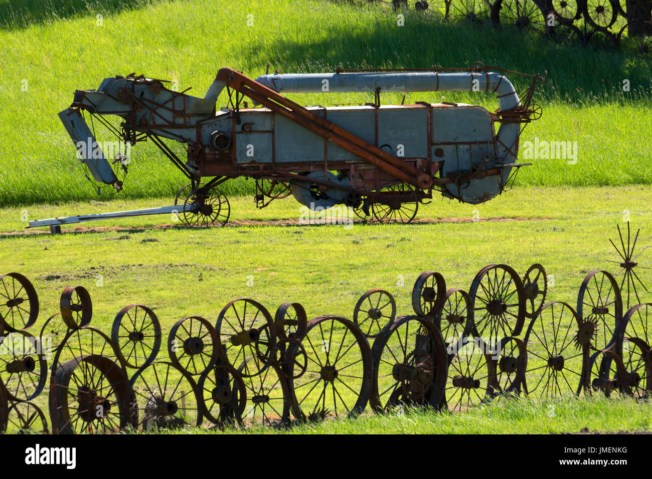 Dahmen Barn farm equipment with wagon wheel fence, Palouse Scenic Byway ...