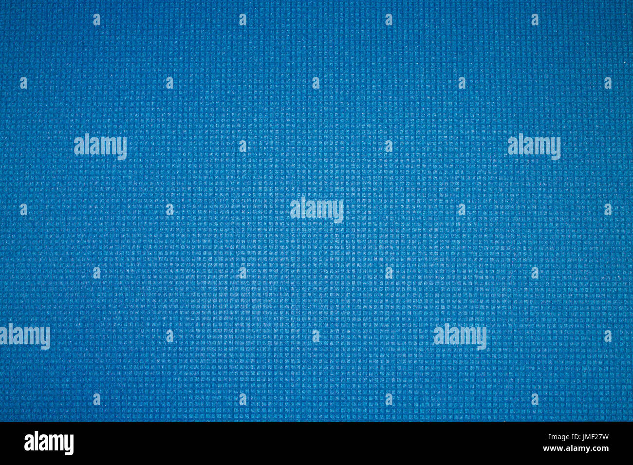 Blue background. Mat for sport, yoga and meditation Stock Photo - Alamy