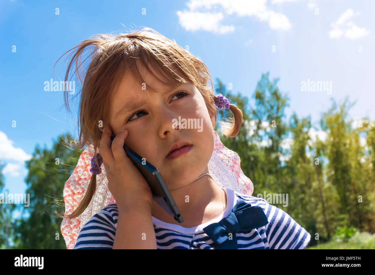 Child phone call talking worried hi-res stock photography and images ...