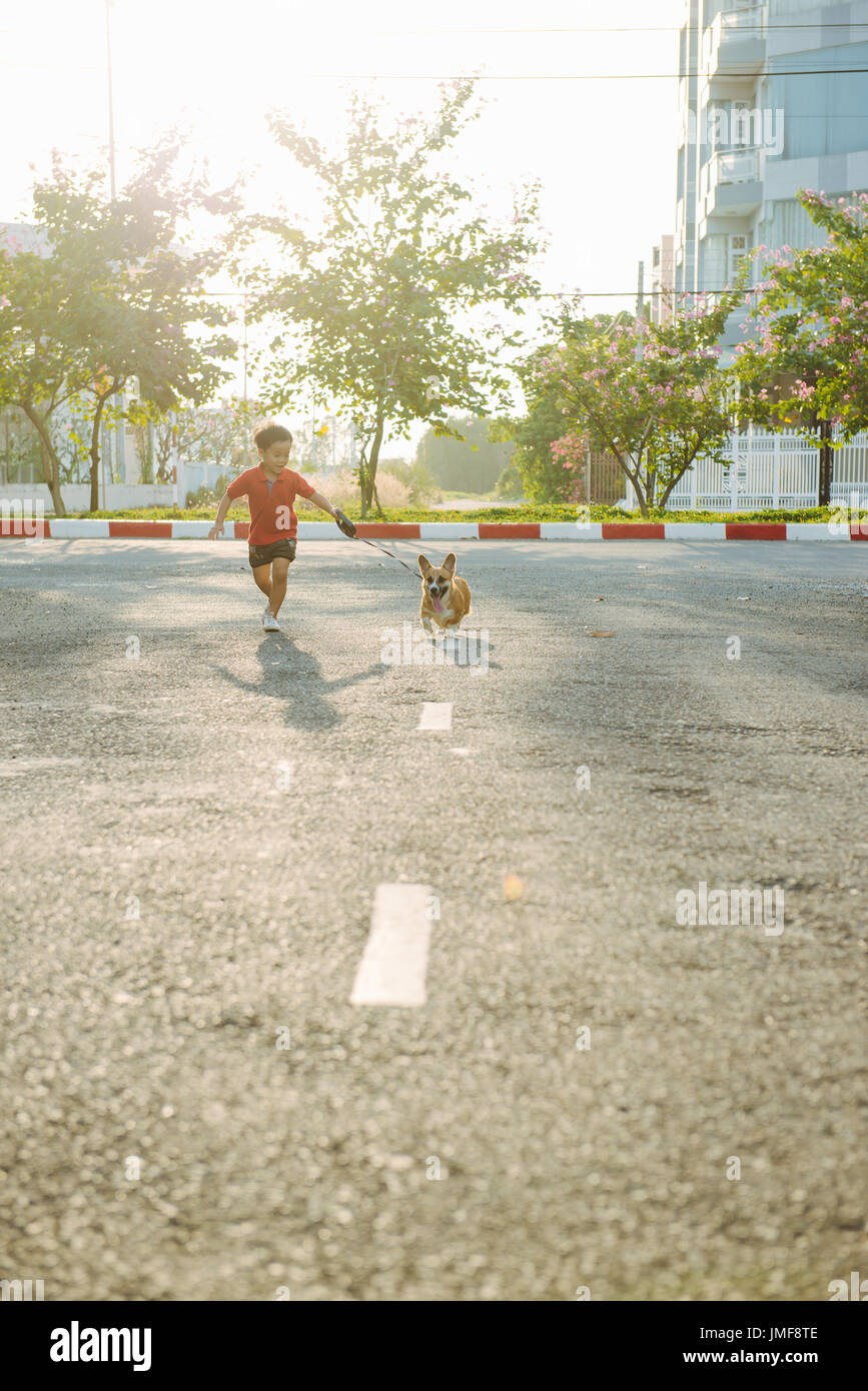 Kid run street hi-res stock photography and images - Alamy