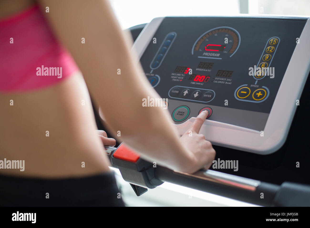 Young Chinese woman exercising on treadmill in gym Stock Photo - Alamy