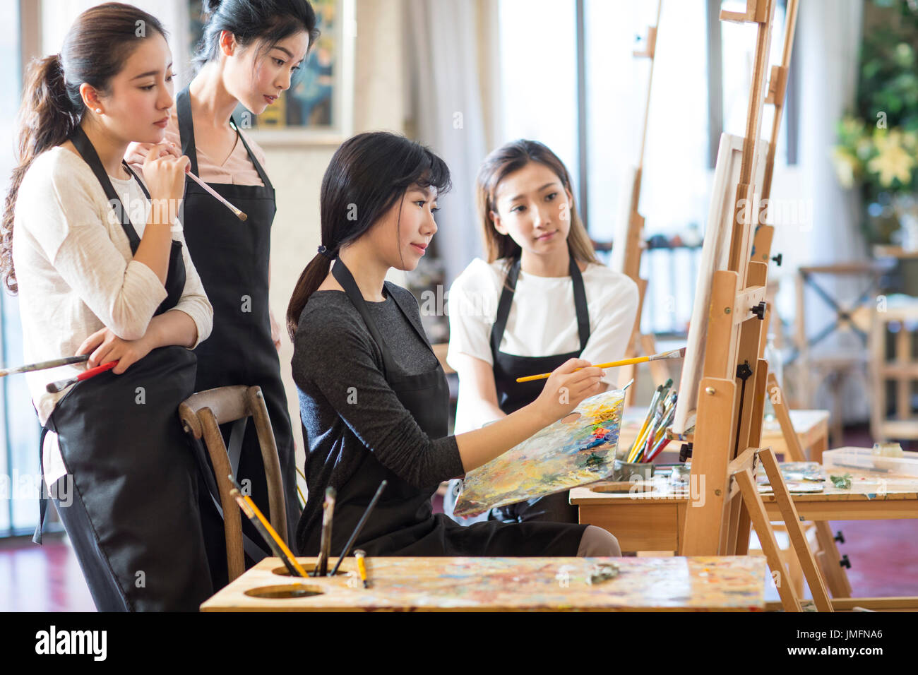 Female artist teaching young hi-res stock photography and images - Alamy