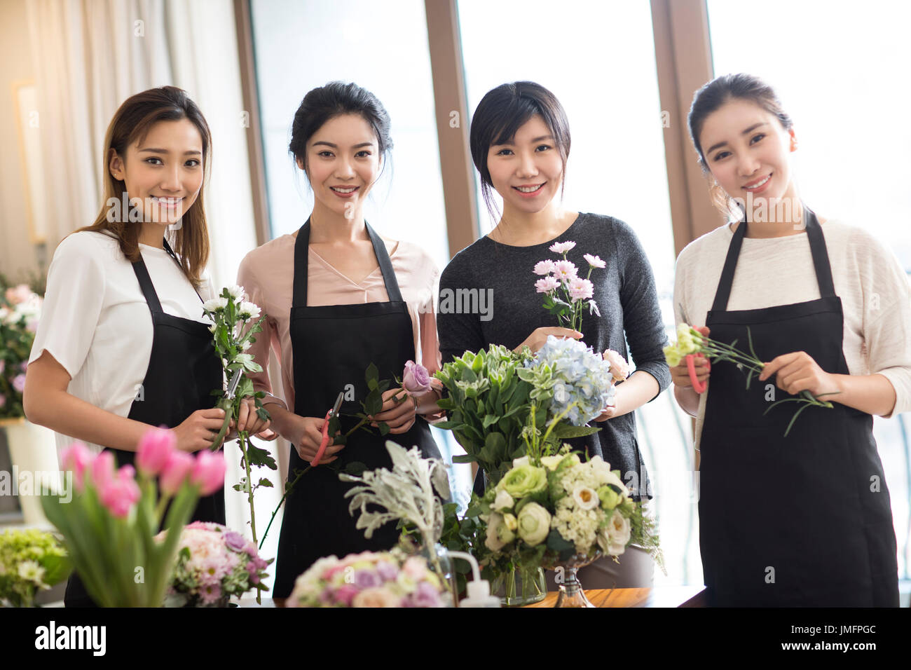 Young women learning flower arrangement Stock Photo - Alamy