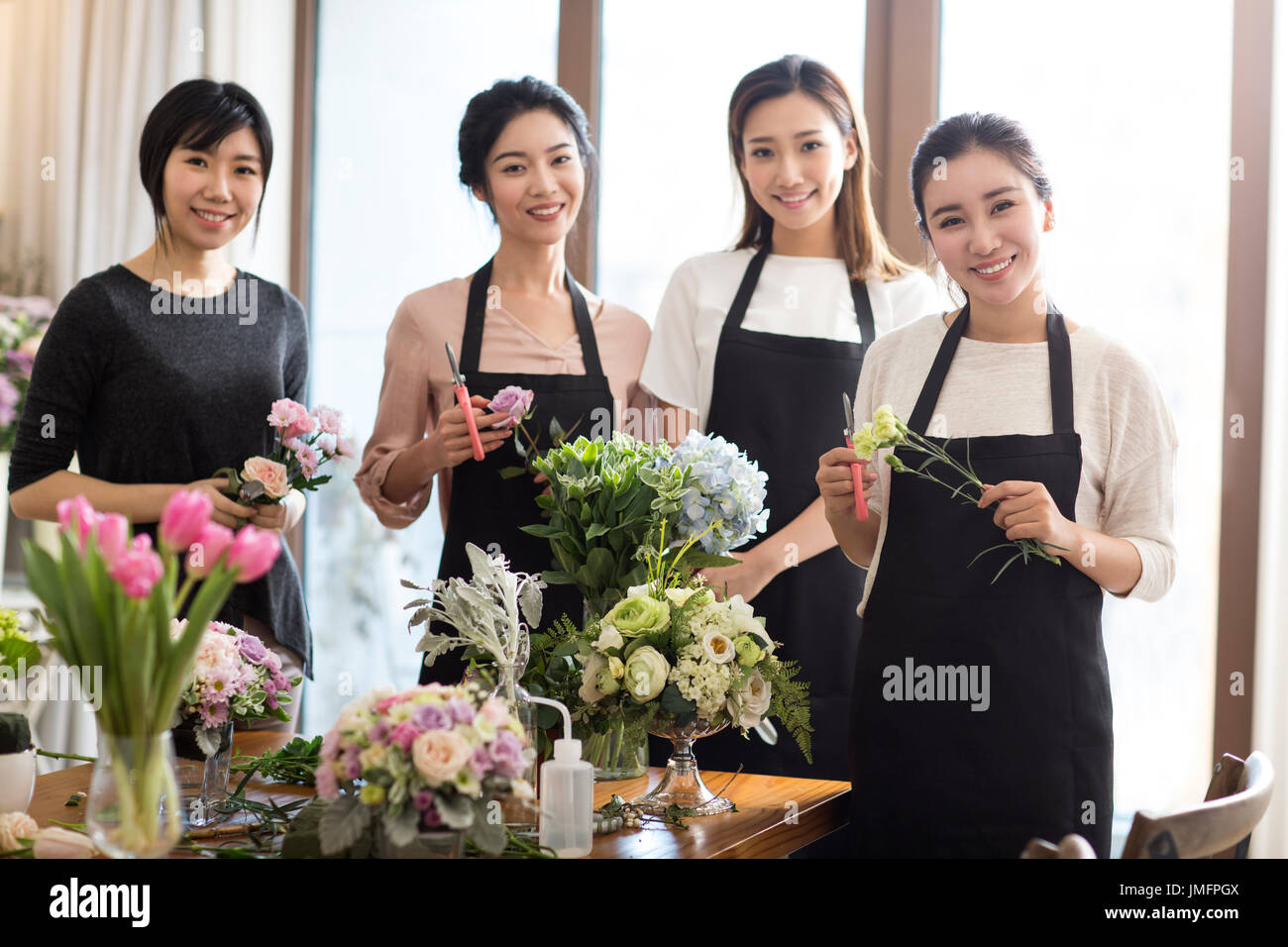 Young women learning flower arrangement Stock Photo - Alamy