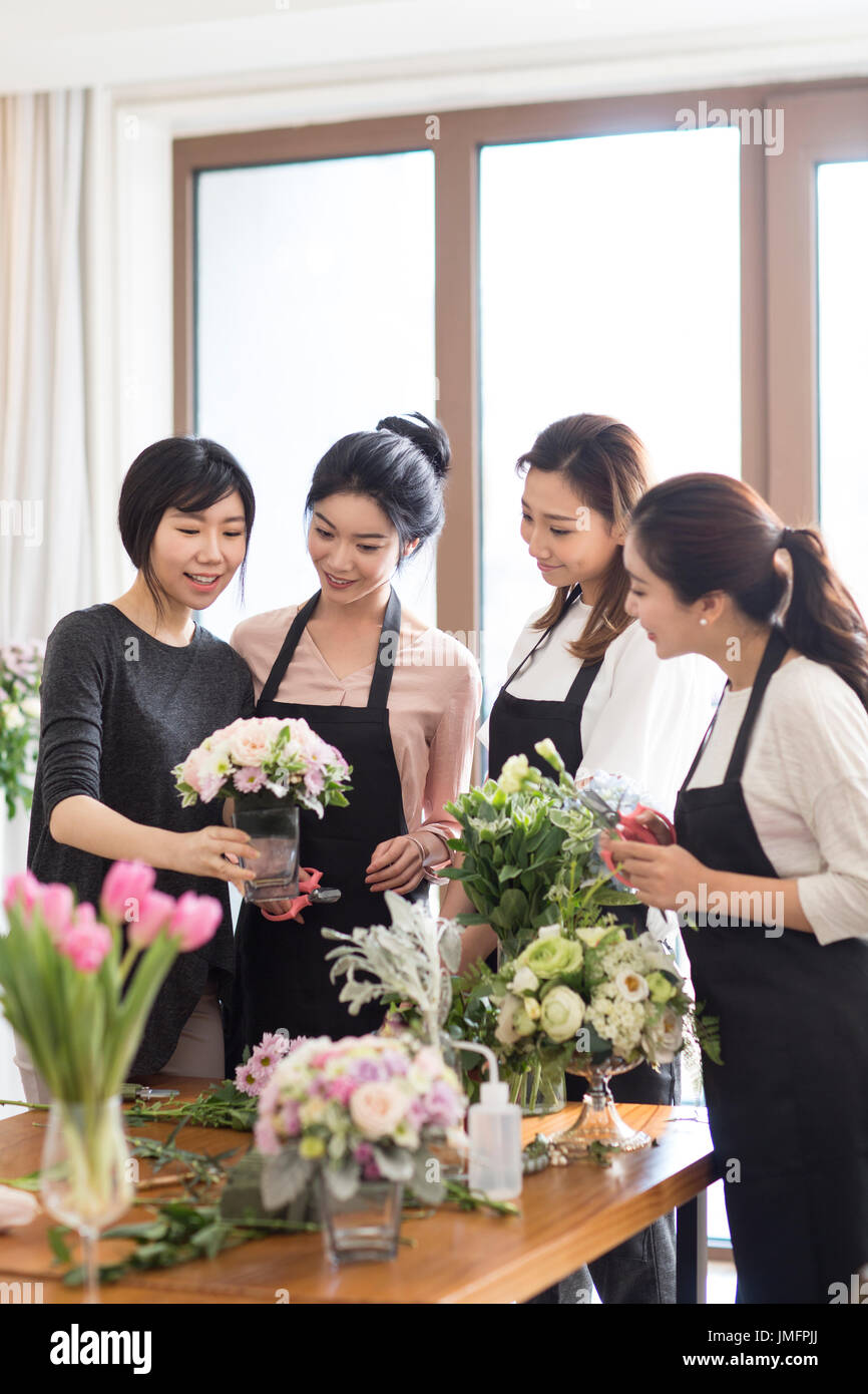 Young women learning flower arrangement Stock Photo - Alamy
