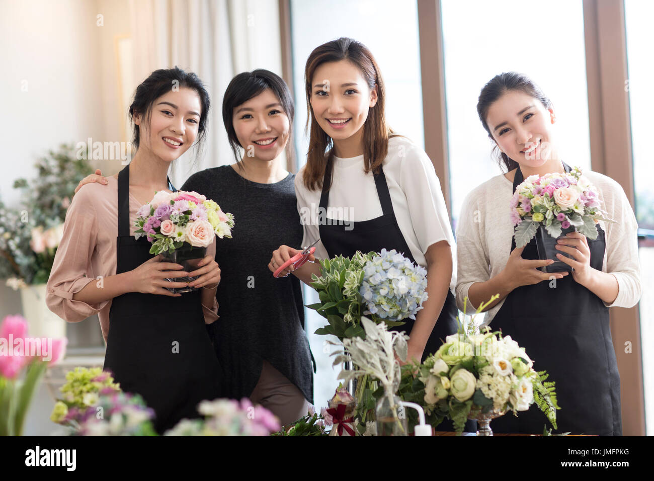 Young women learning flower arrangement Stock Photo - Alamy