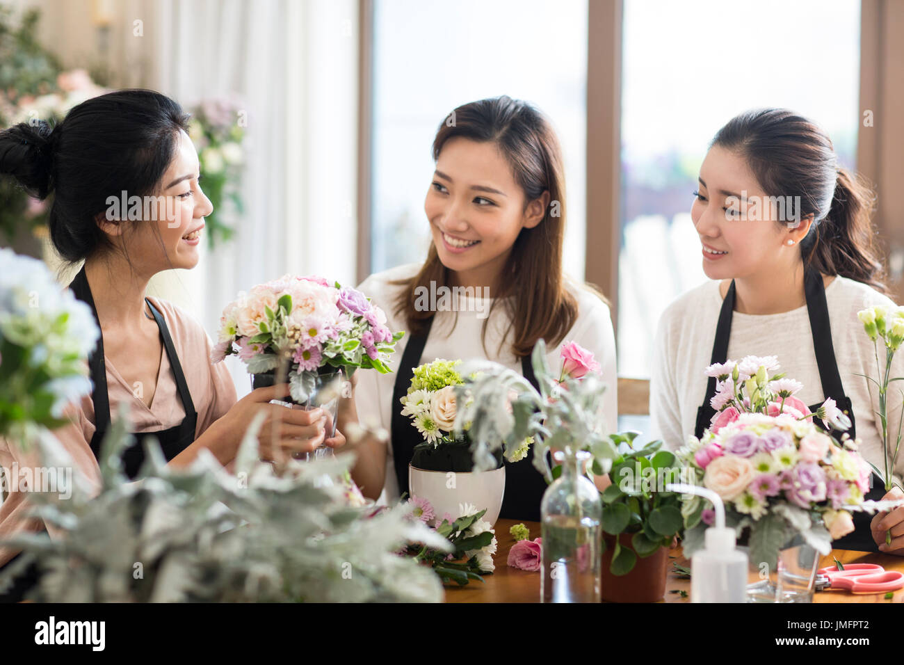 Young women learning flower arrangement Stock Photo - Alamy