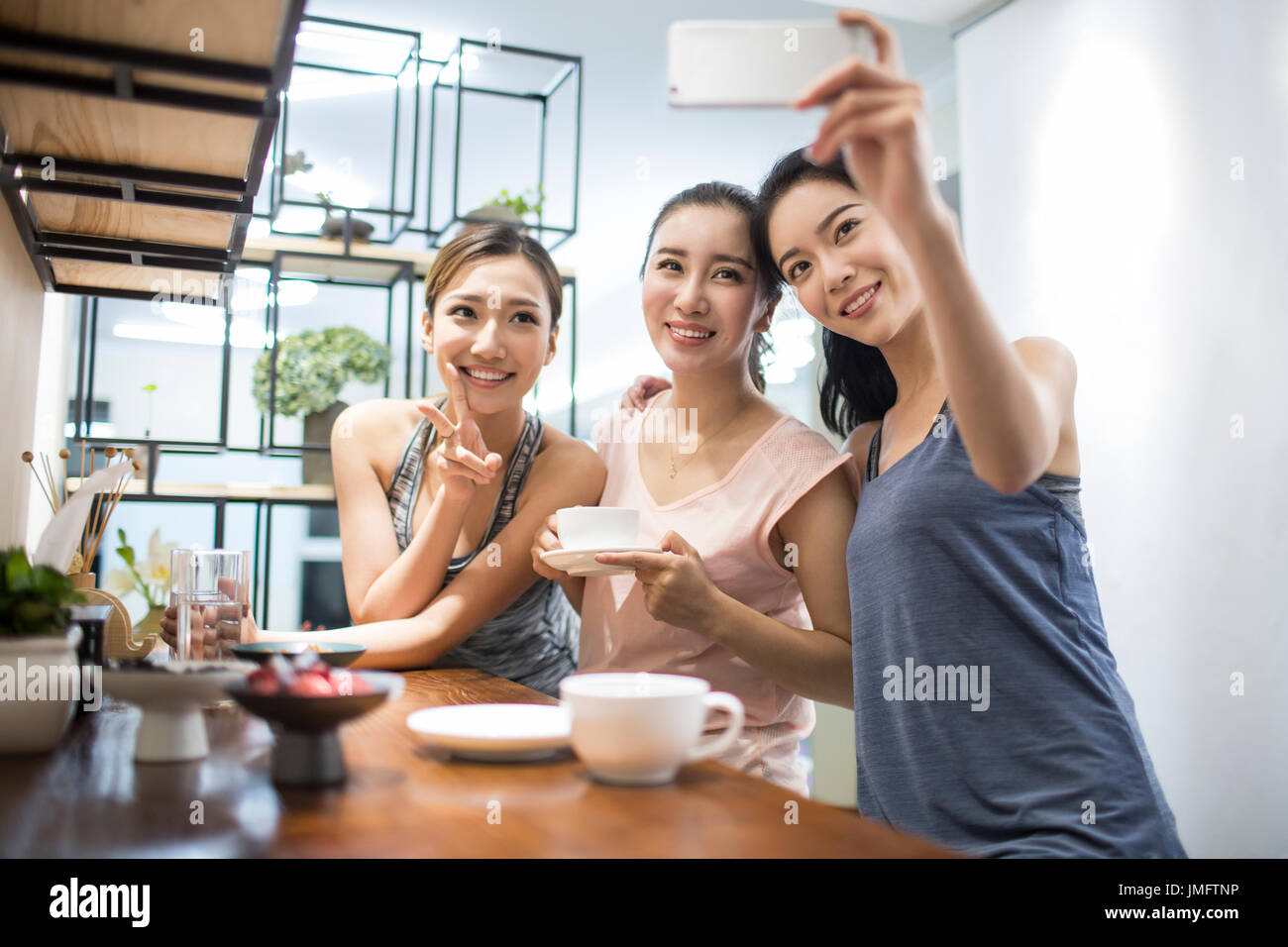 Best female friends drinking coffee Stock Photo - Alamy