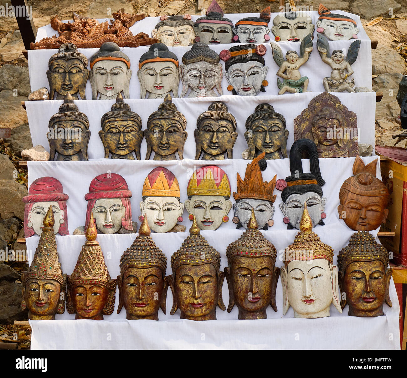 Souvenirs (wooden masks) for sale at the shop in Innwa Town, Mandalay ...