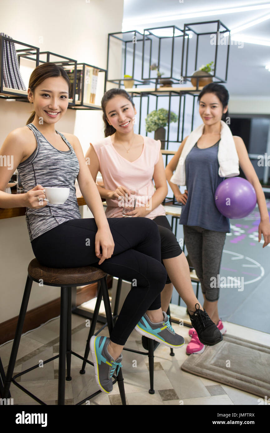 Best female friends resting at gym Stock Photo - Alamy