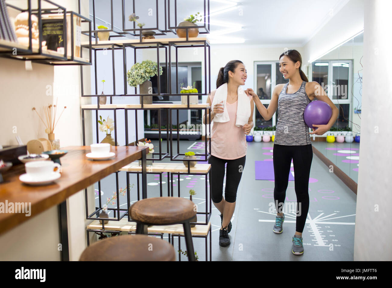 Best female friends resting at gym Stock Photo - Alamy