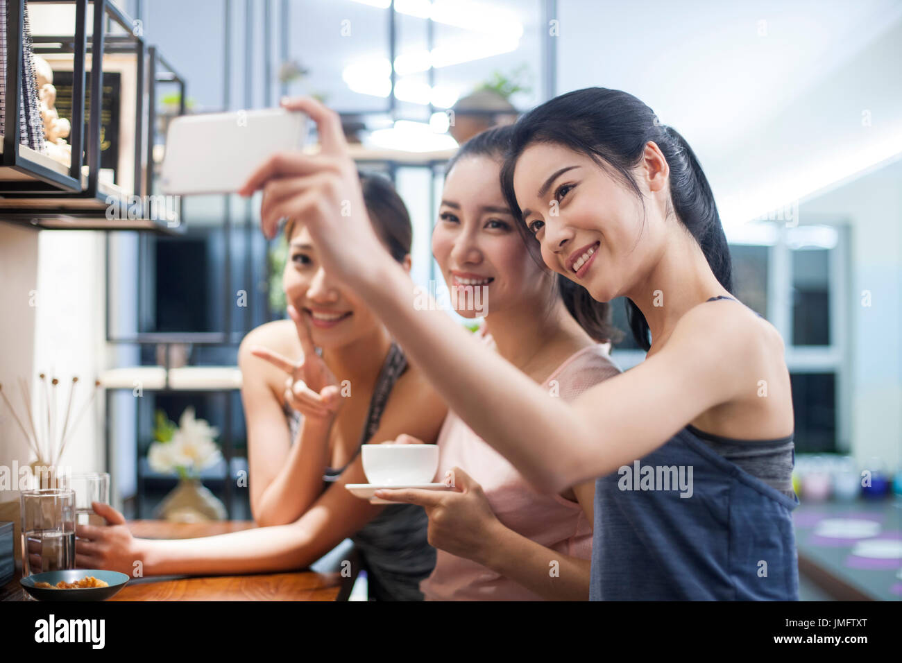 Best female friends taking self portrait Stock Photo - Alamy