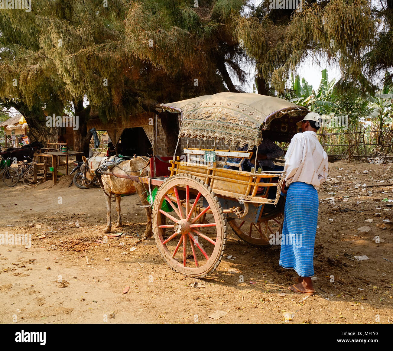 Mandalay, Myanmar - Feb 22, 2016. Horse cart waiting at Innwa Town in ...