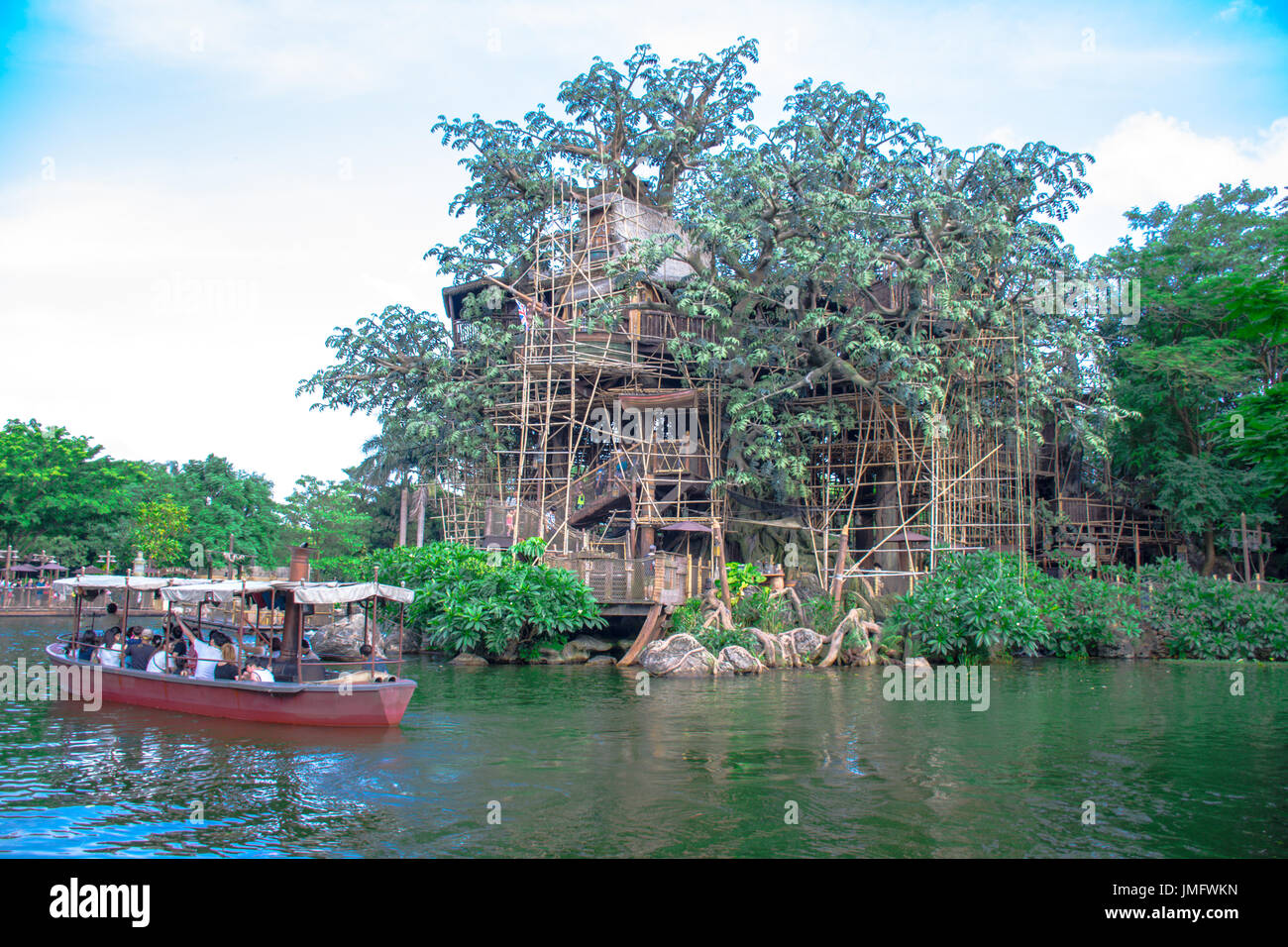 A boat full of passengers travelling through the river around the ...