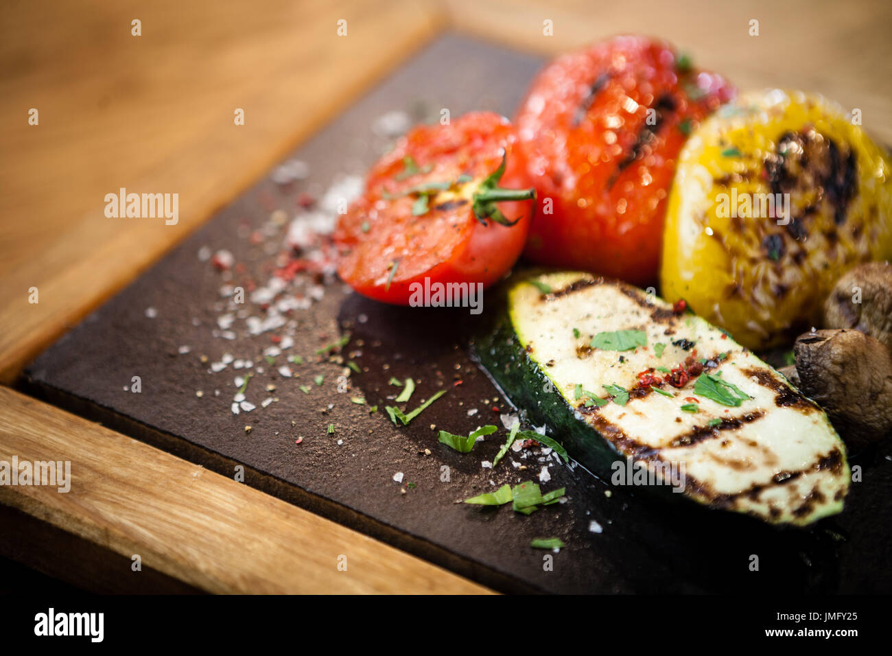 Grilled vegetables on a stone board Stock Photo - Alamy