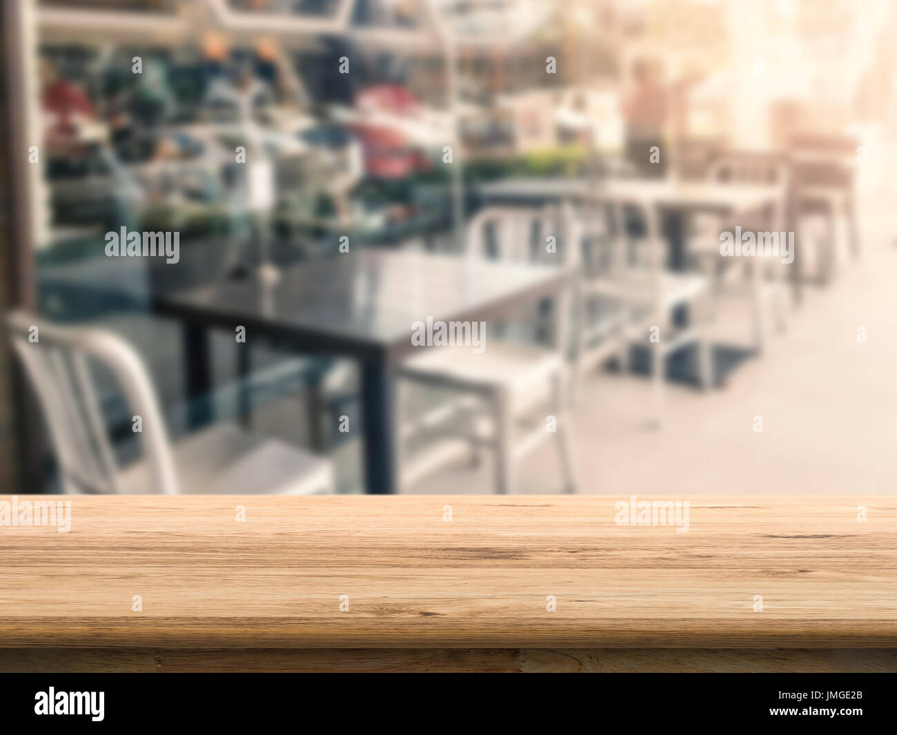 wooden table with empty restaurant background Stock Photo - Alamy