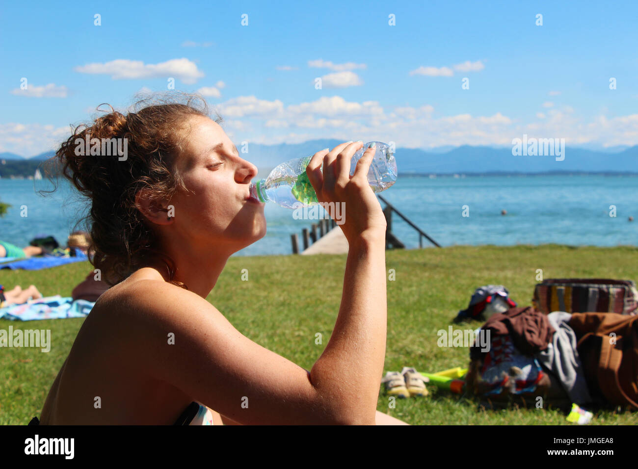 Young woman drinking refreshing water Stock Photo - Alamy