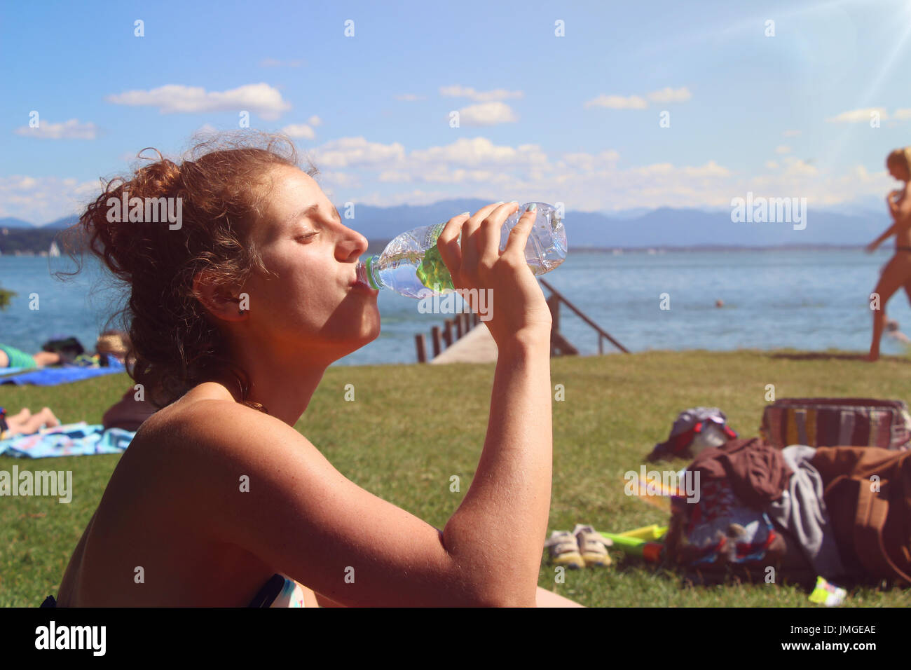 Young woman drinking refreshing water Stock Photo - Alamy