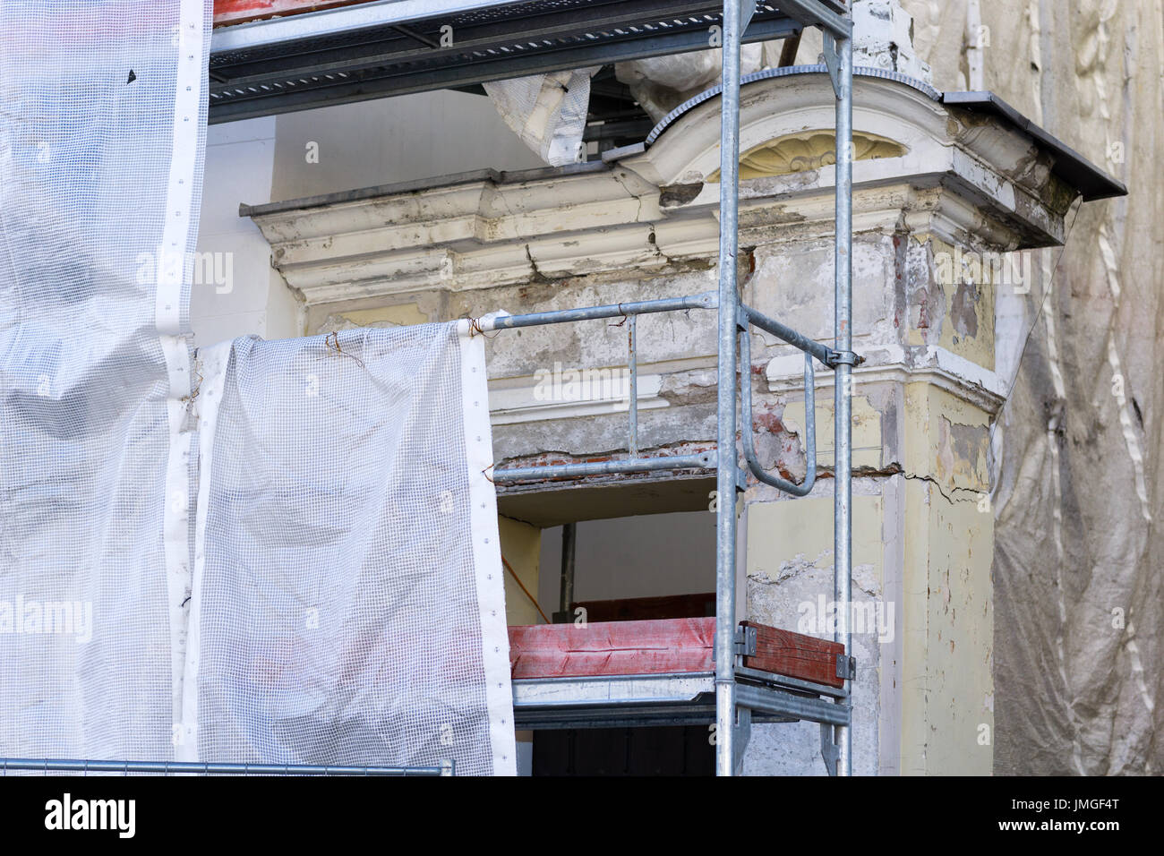 Renovated Building with Scarfold covered with material Stock Photo - Alamy