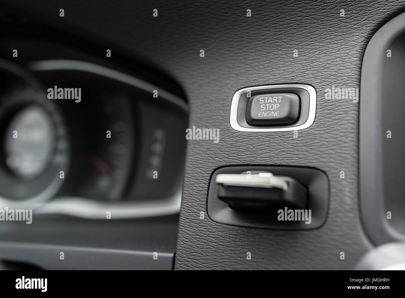 Close-up on automatic starter, start stop engine button in modern car ...