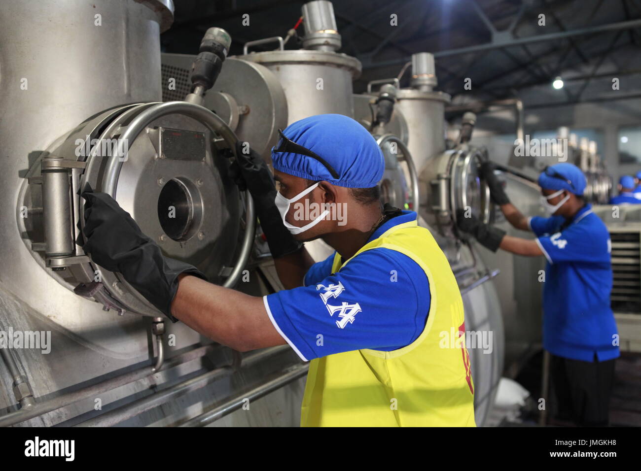 Workers in a dyeing section of a ready-made garment factory at ...