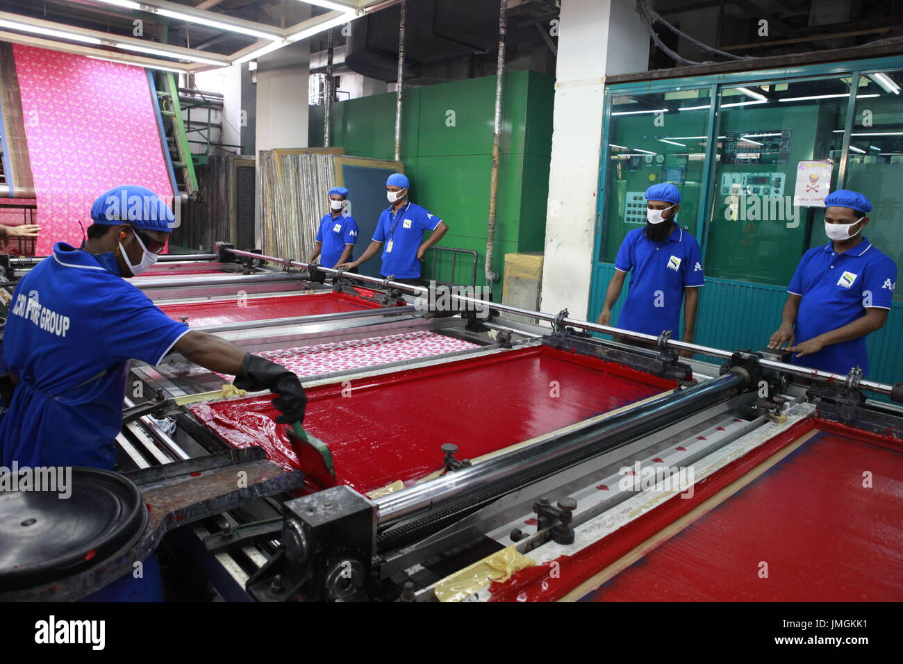 Workers in a printing section of a ready-made garment factory at ...