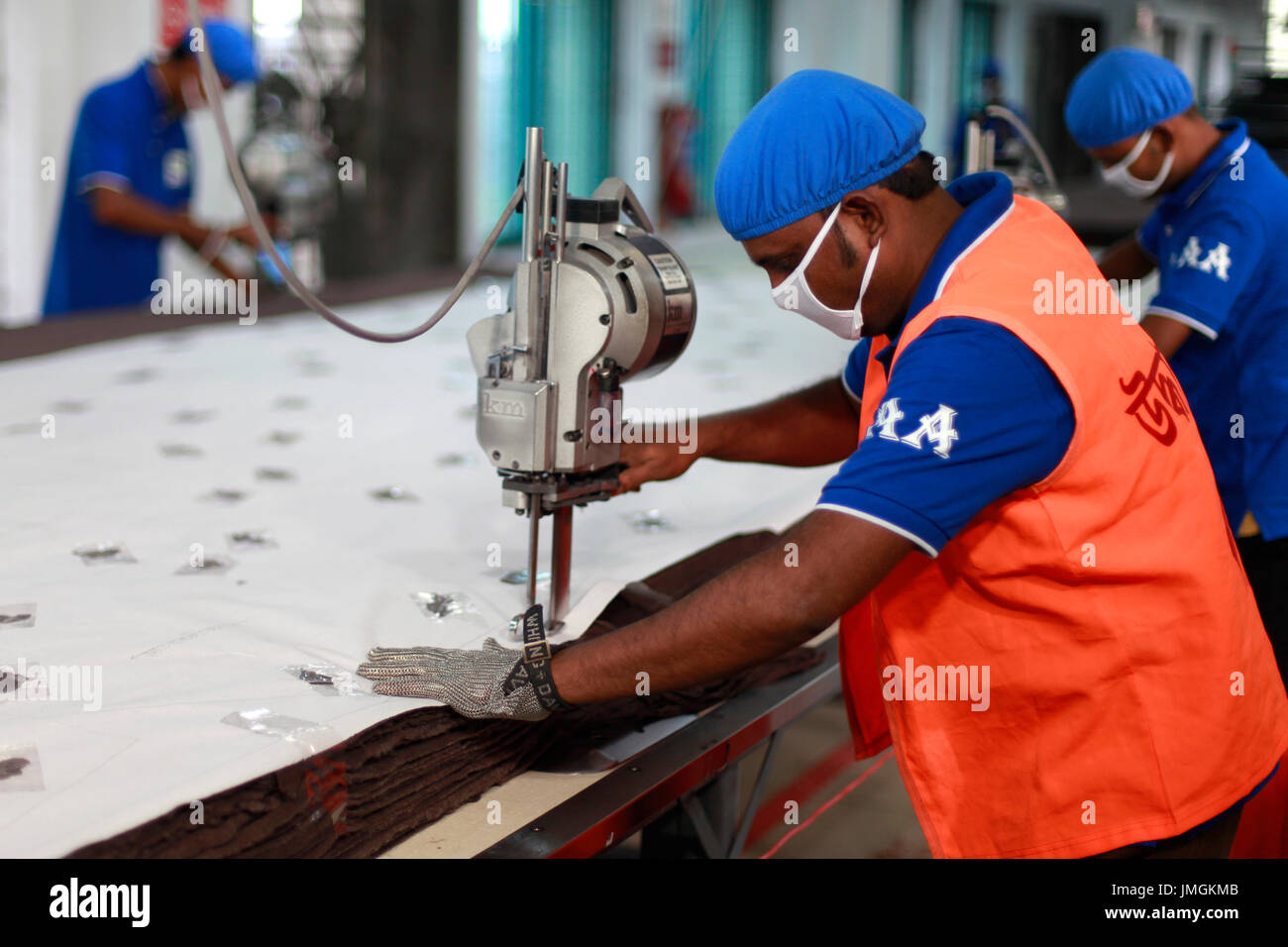 Workers in a cutting section of ready-made garment factory at ...