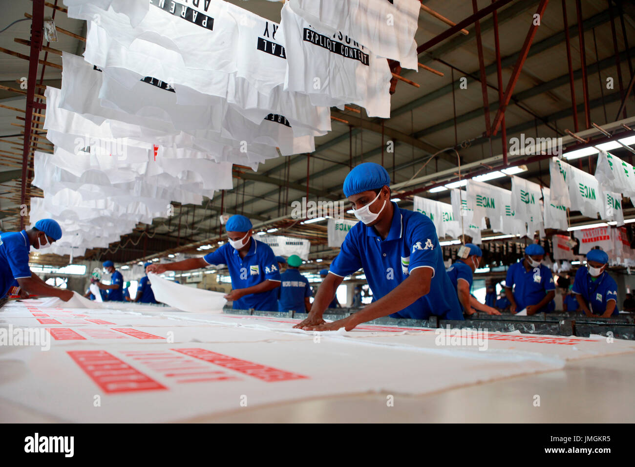Workers in a printing section of a ready-made garment factory at ...