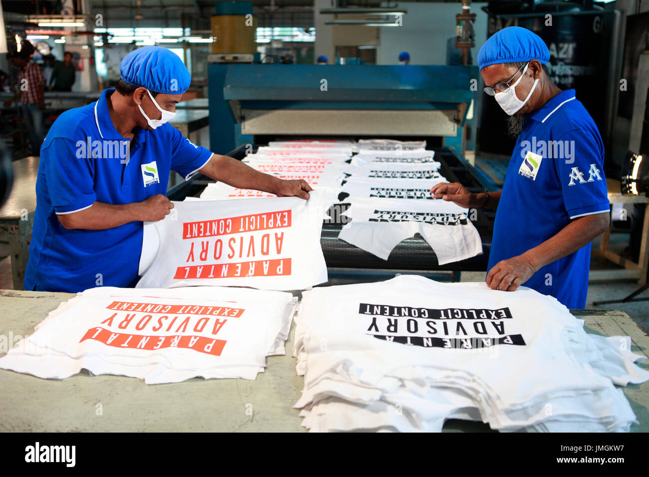 Workers in a printing section of a ready-made garment factory at ...