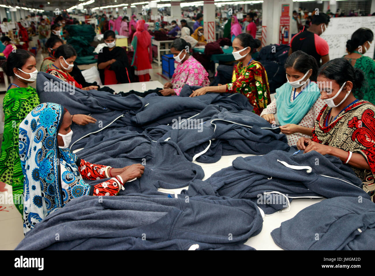Workers in a ready-made garment factory at Narayanganj on the outskirts ...