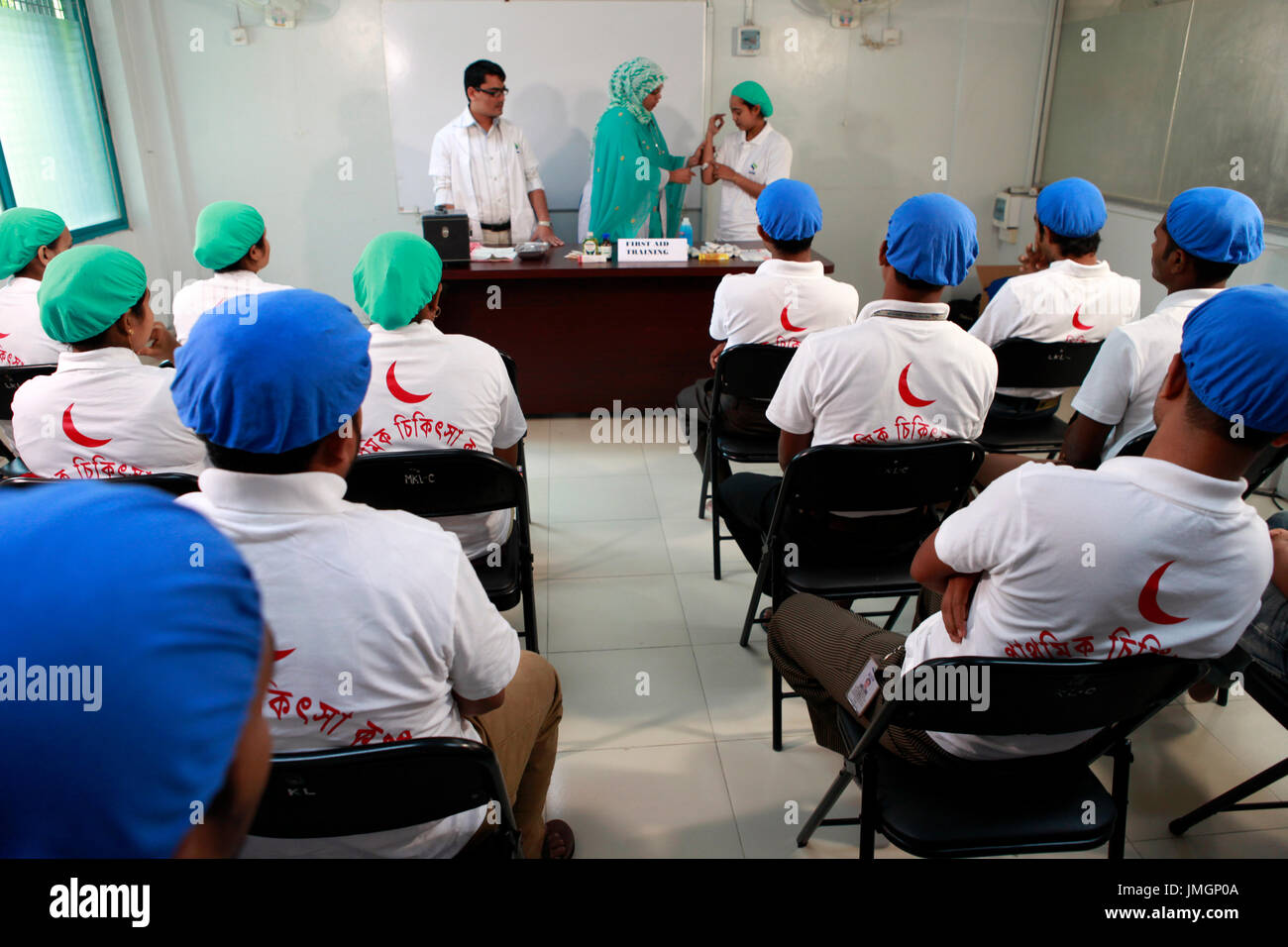 Ready-made garment workers participate in a first aid training session ...