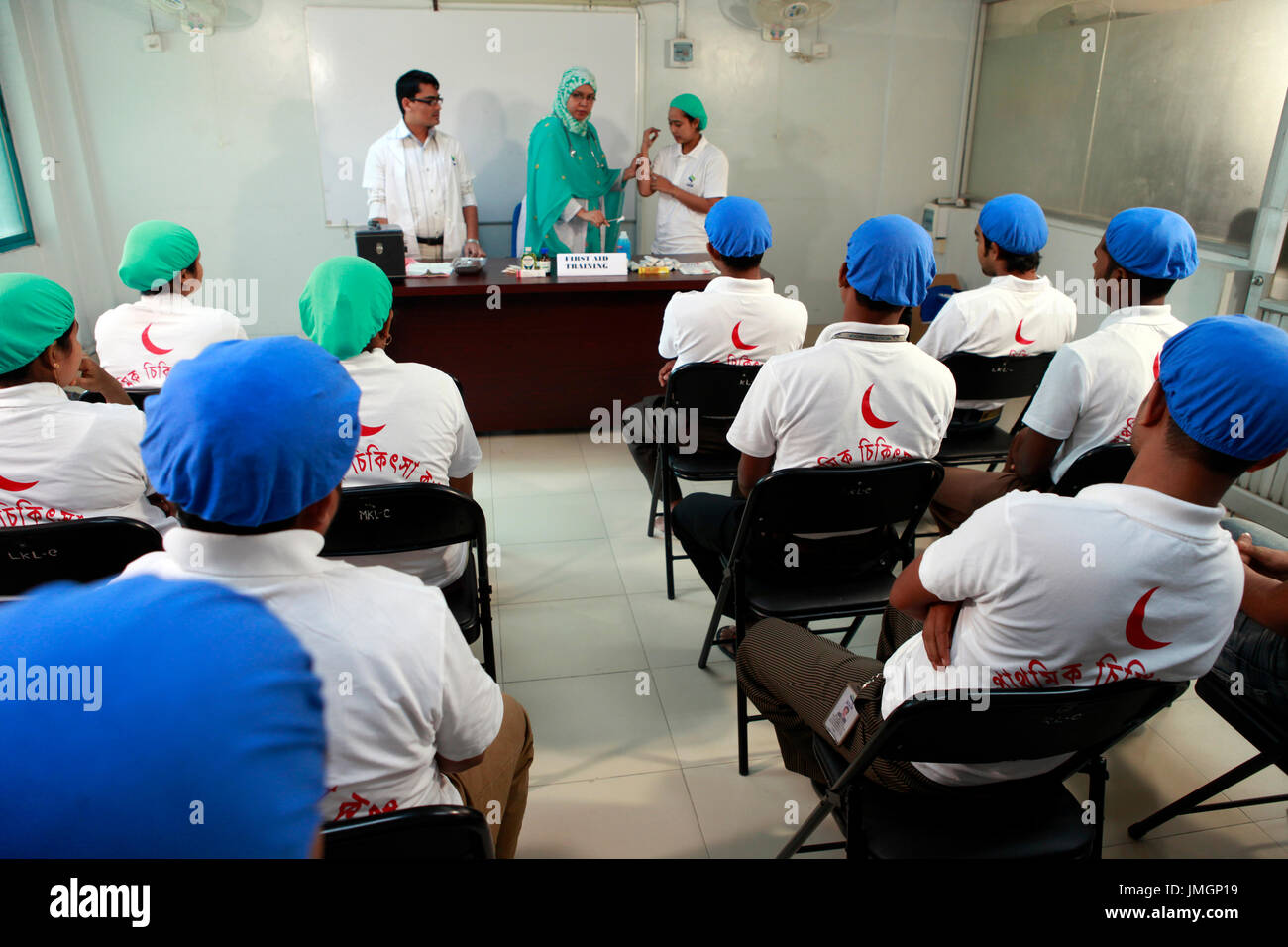 Ready-made garment workers participate in a first aid training session ...