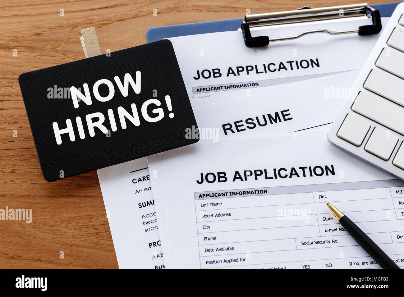 Now hiring sign with job application for hiring concept Stock Photo - Alamy