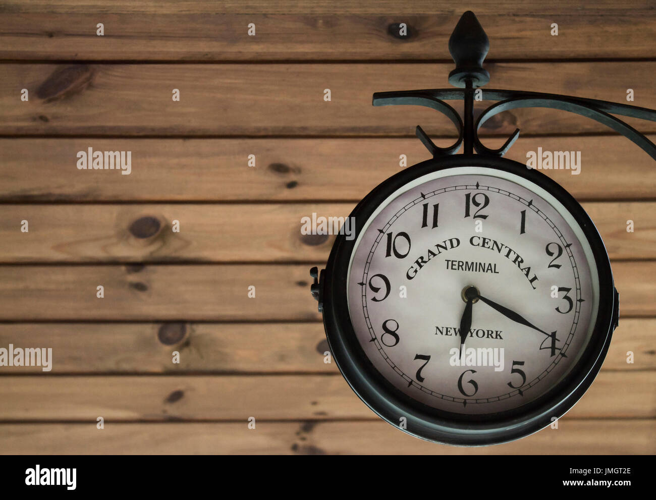 Clock stylized on an old street clock on a wooden background Stock ...