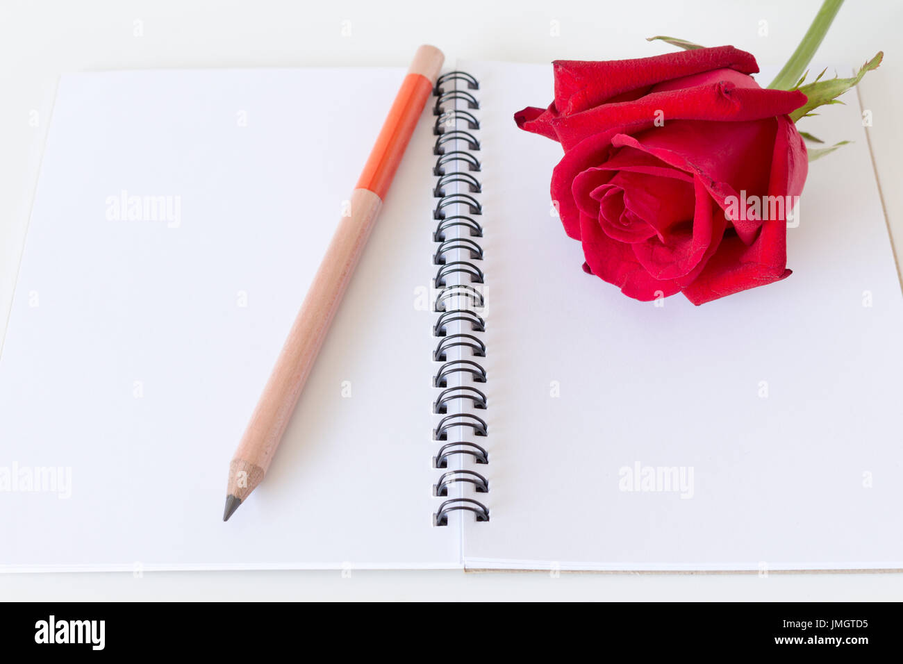 notebook ,pencil and red rose on white background Stock Photo - Alamy