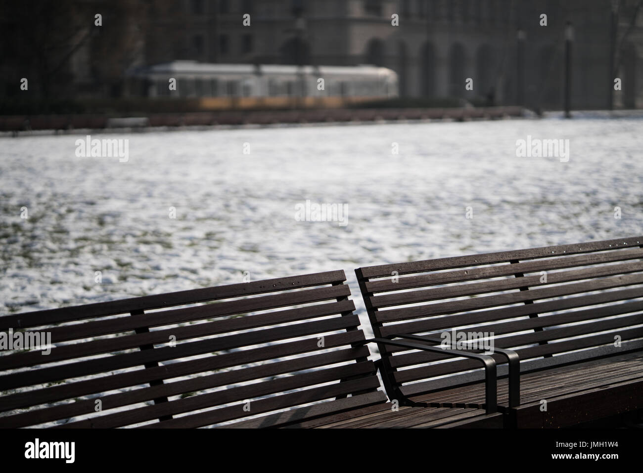 A snow covered bench in budapest, parliament square Stock Photo - Alamy