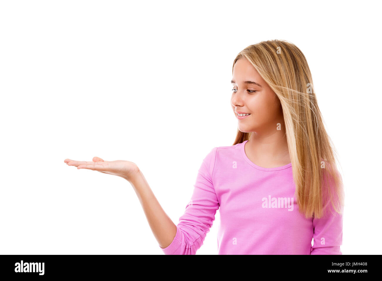 Beautiful girl showing something on the palm of her hand on white ...