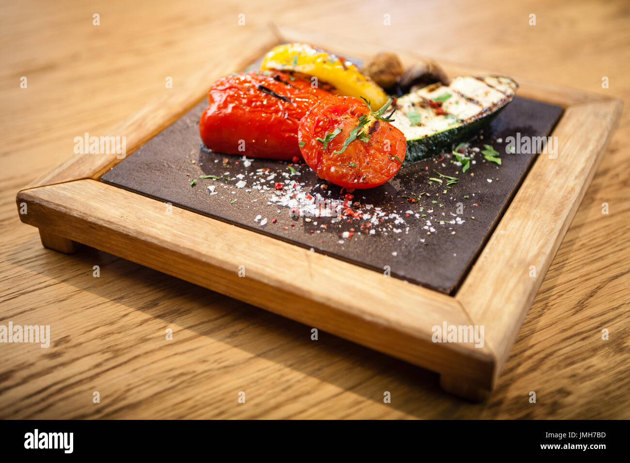 Grilled vegetables on a stone board Stock Photo - Alamy