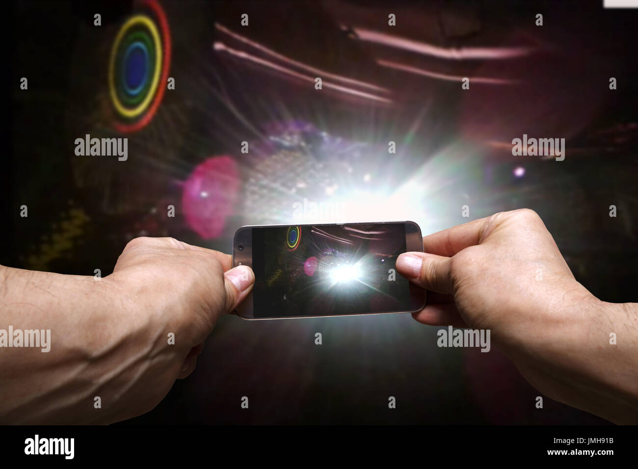 Mobile phone in a club Stock Photo - Alamy